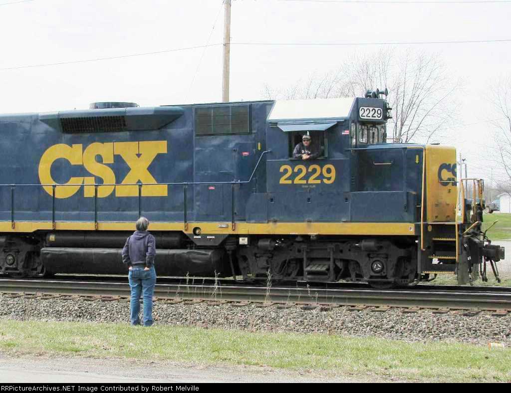 Engineer chats with my wife while rail is pulled aboard